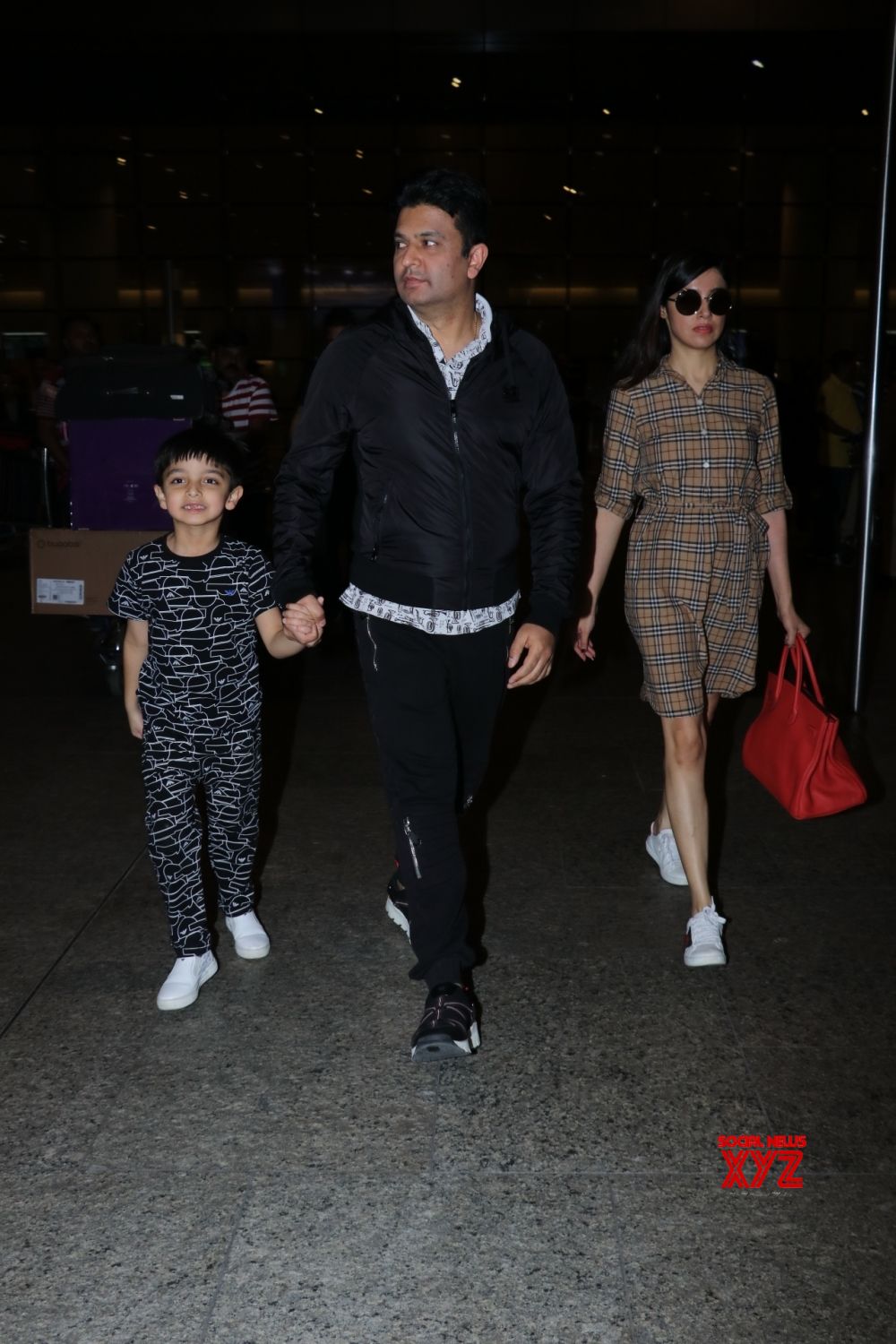 Mumbai: Bhushan Kumar, Divya Khosla Kumar and Ruhaan Kumar seen at ...