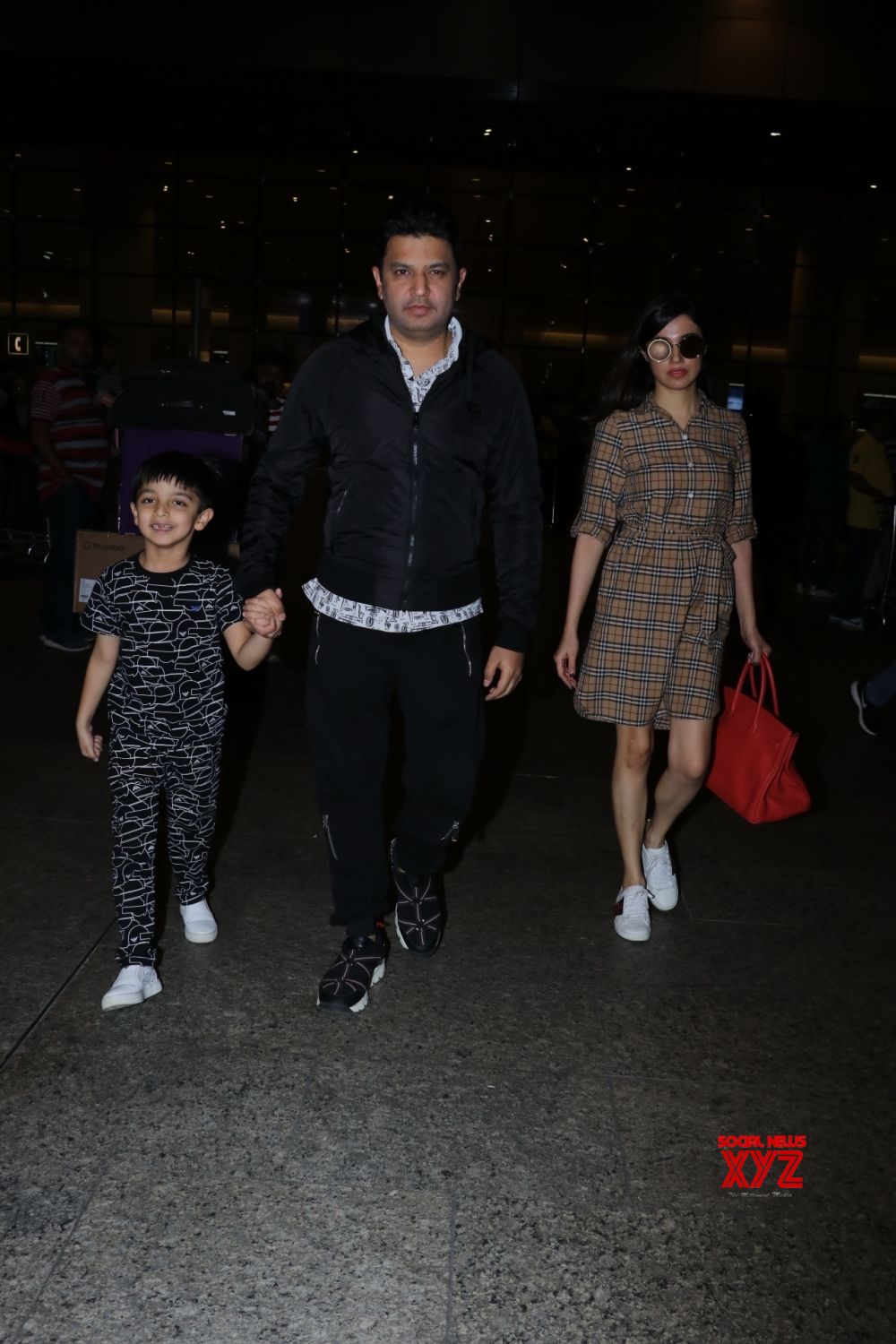 Mumbai: Bhushan Kumar, Divya Khosla Kumar and Ruhaan Kumar seen at ...