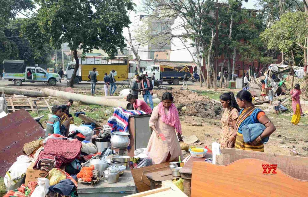 Patna: People with their household items after the demolition at ...