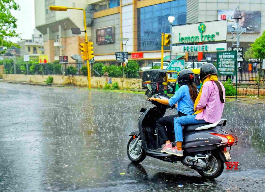 : Jaipur: Women ride a two - wheeler amid heavy rain #Gallery - Social ...