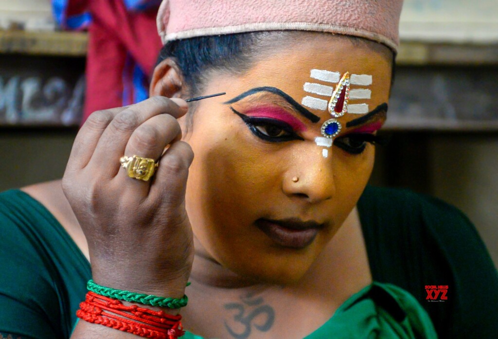 Chennai: An artist applies makeup before performing at the 'Veedhi ...