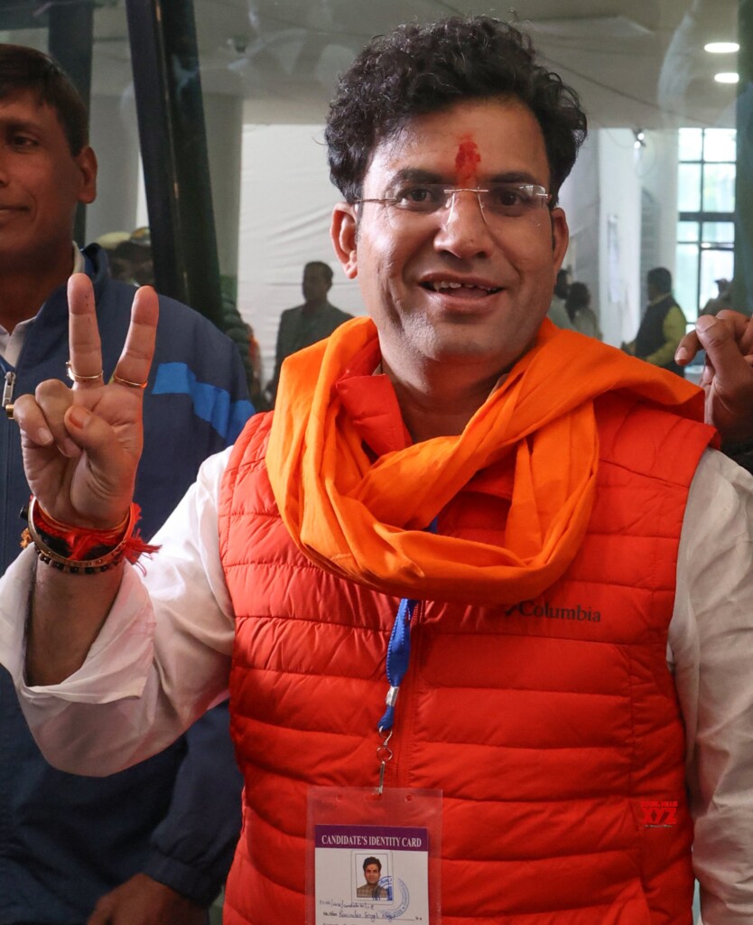 New Delhi: BJP candidate Ravinder Singh Negi celebrates after his win ...